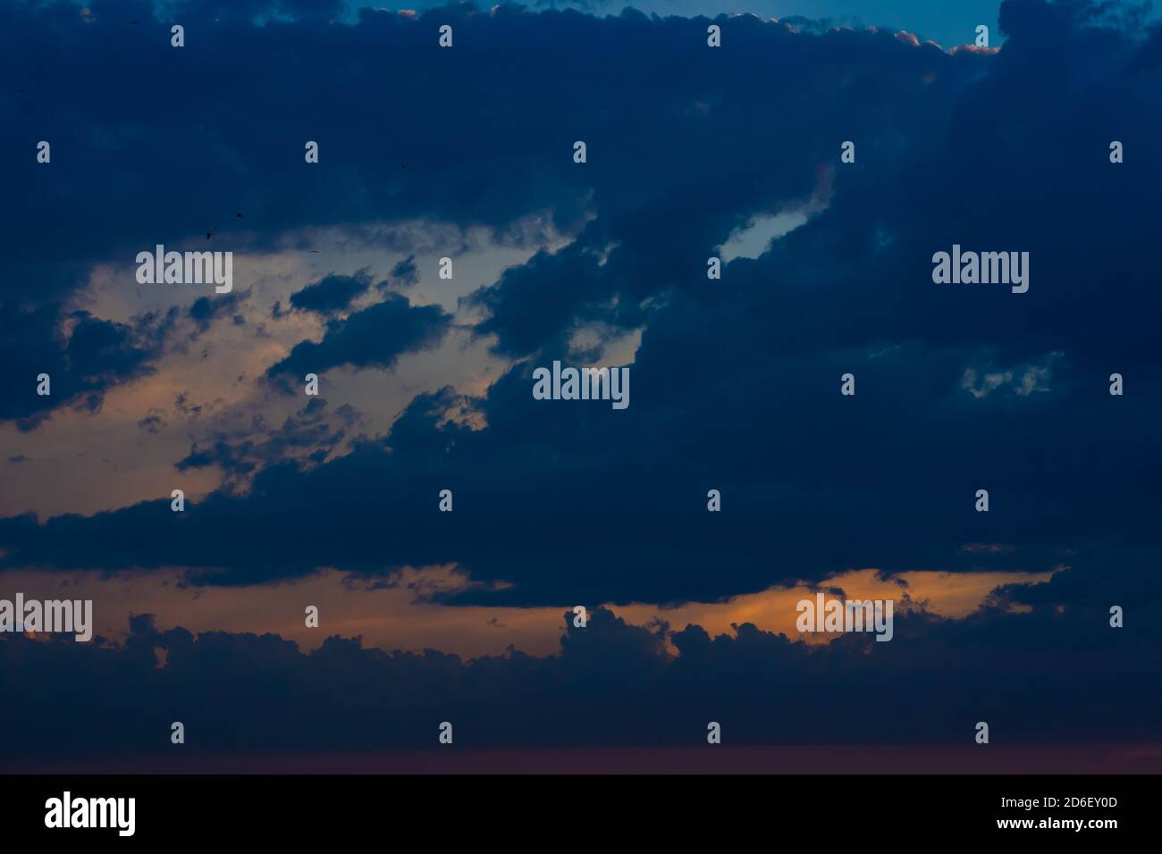 Heavy cloudy sky at sunset. A landscape of beautiful nature Stock Photo ...