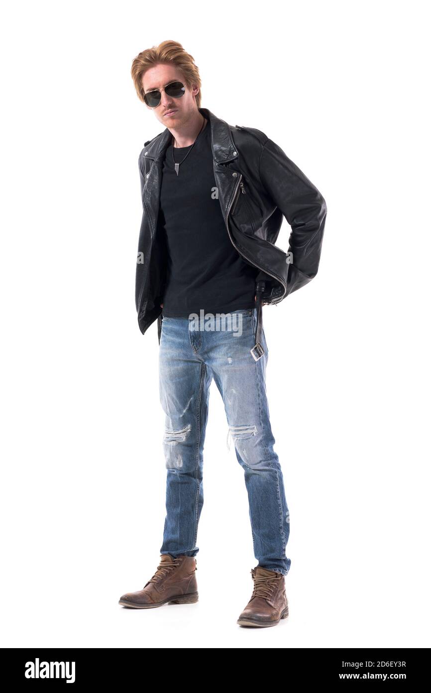 Cool relaxed stylish biker in leather jacket getting dressed with hands ...