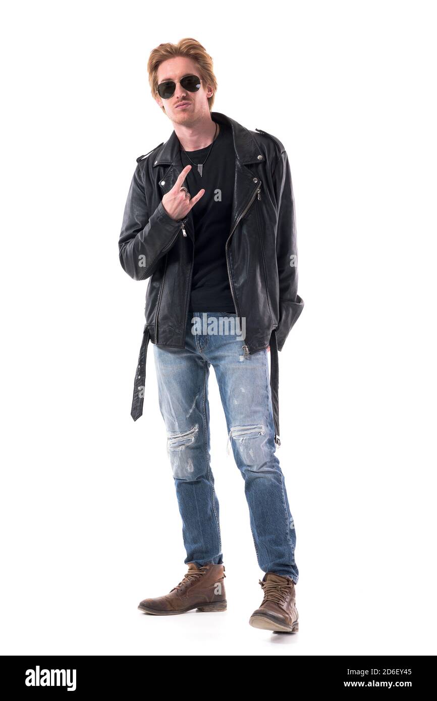 Macho rocker man showing two finger horns or devil hand sign gesture in ...