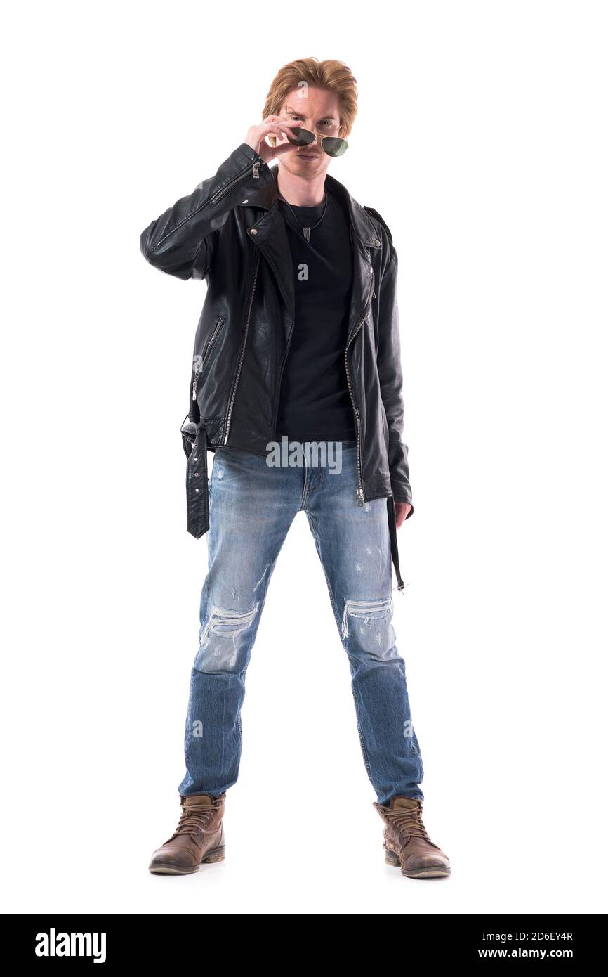 Macho young stylish man fashion model in leather jacket and jeans ...