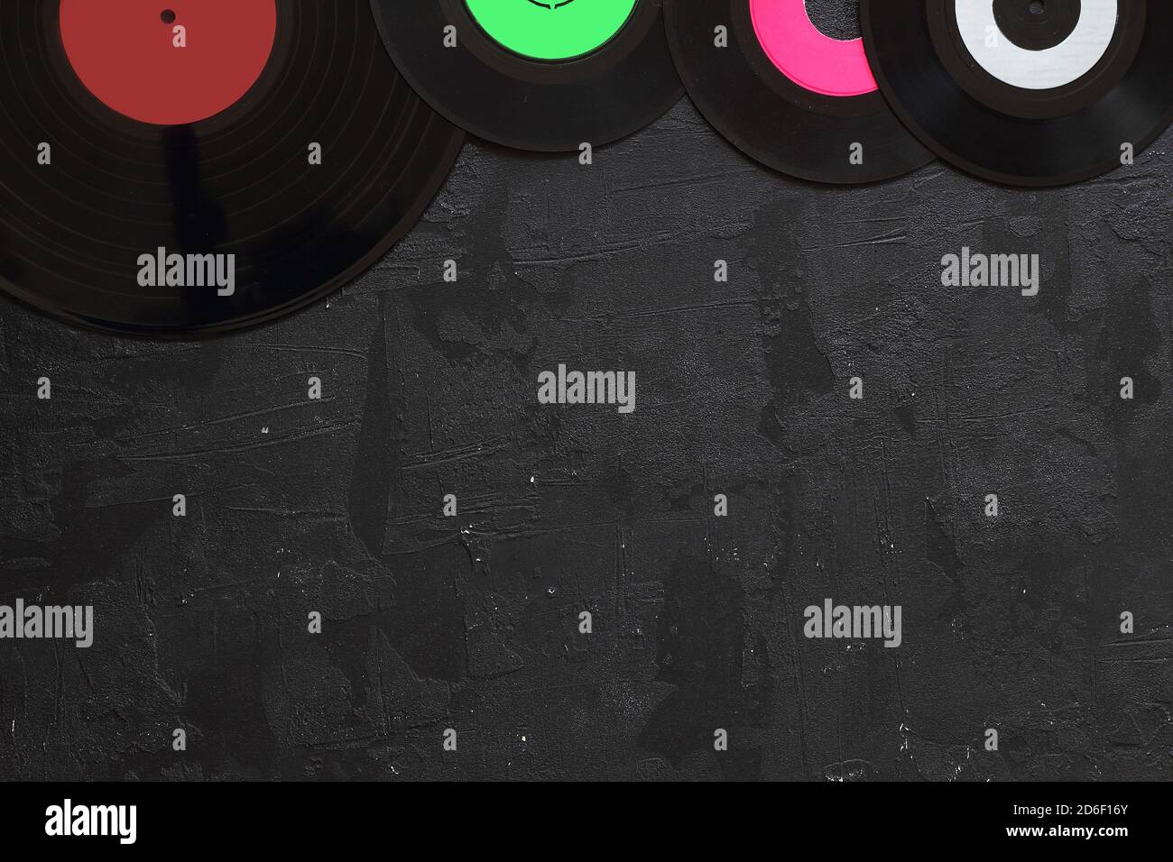 Vinyl record on a black background. Retro style. Top view Stock Photo ...