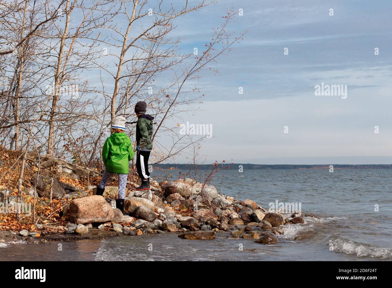 Two children playing on rocks hi-res stock photography and images - Alamy