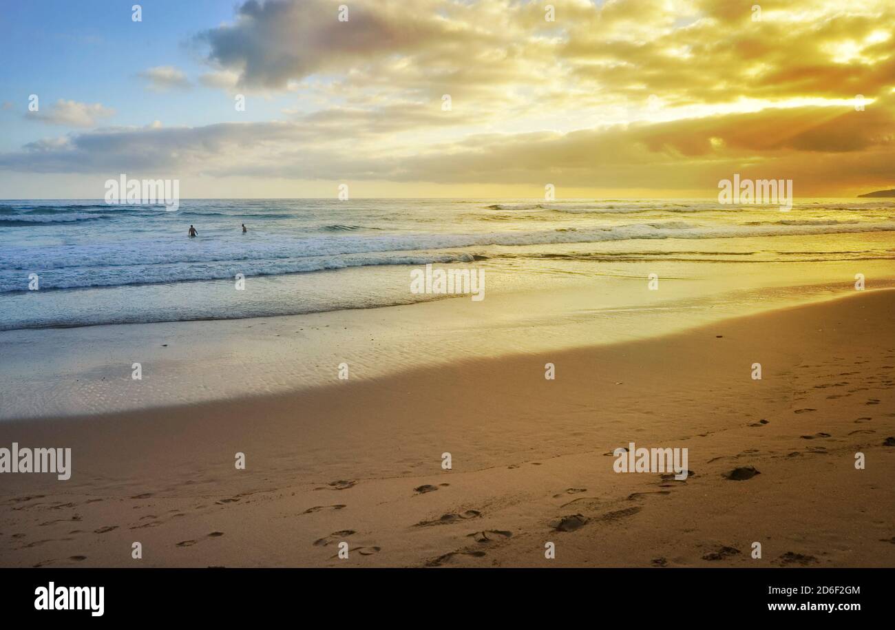 Sandy beach at sunset Stock Photo - Alamy