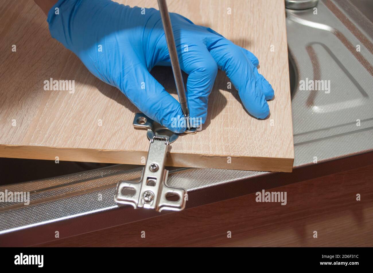 Door hinge installation. Male hand fixing, home small repairs Stock ...