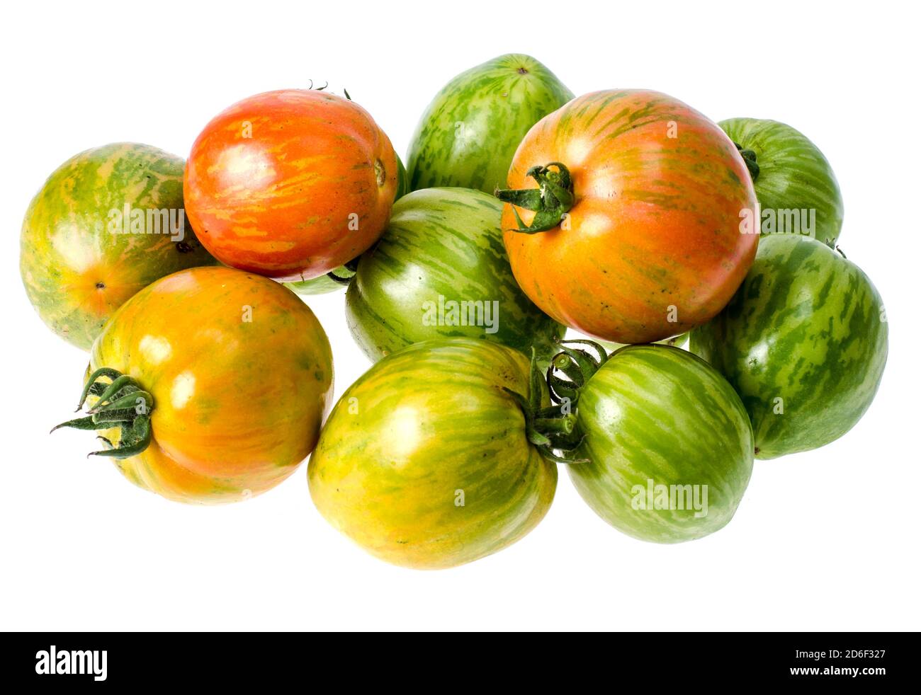 Green and ripe tomatoes with striped skin color. Studio Photo Stock ...
