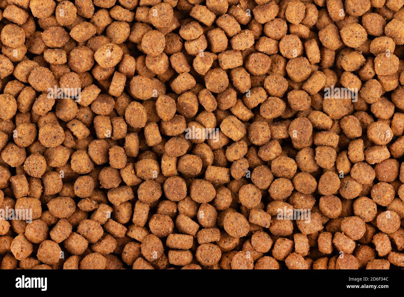Dry pet food background. Pile of granulated animal feeds. Granules of ...