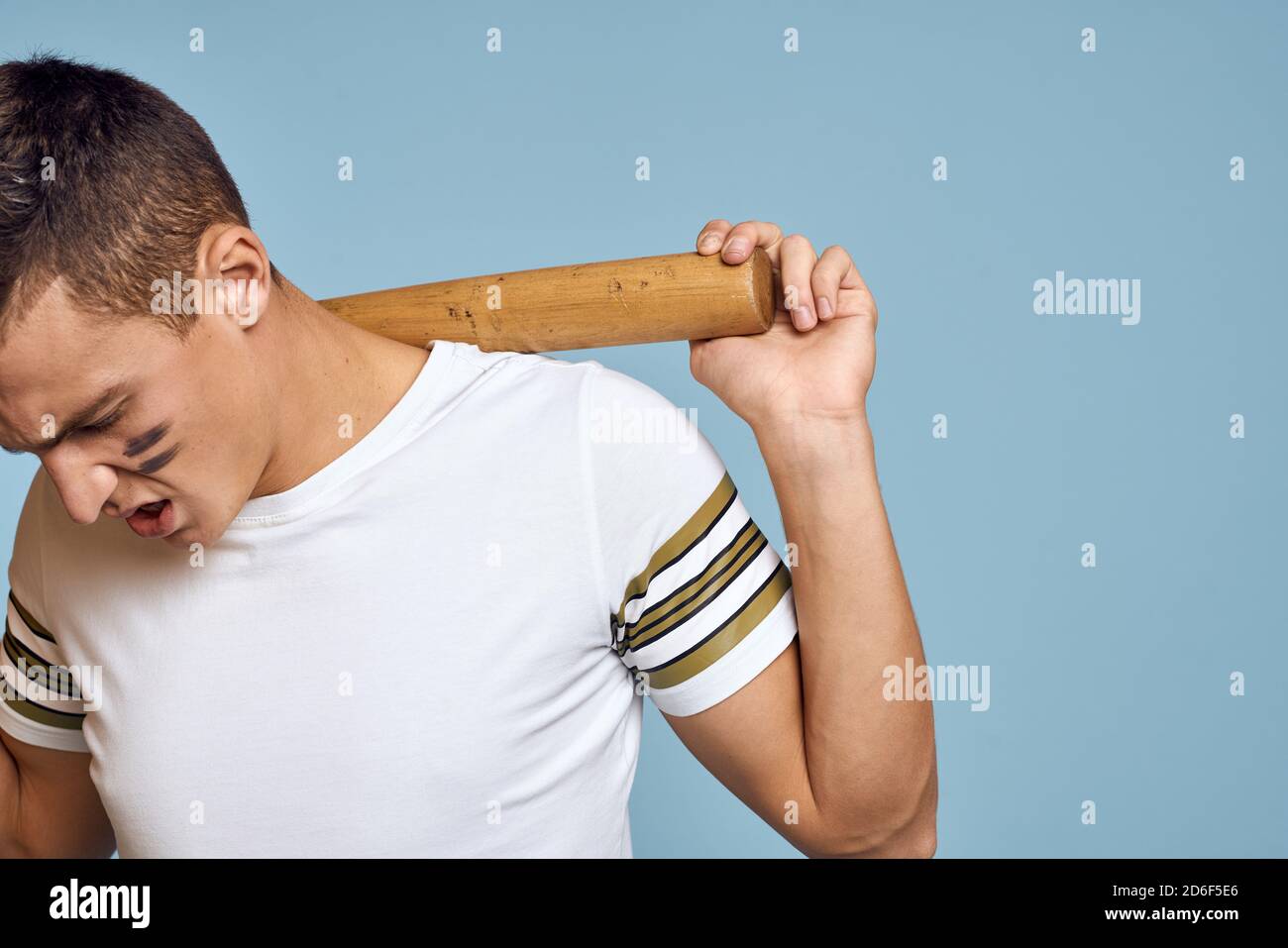 baseball guy with a bat in his hand on a blue background and a combat ...