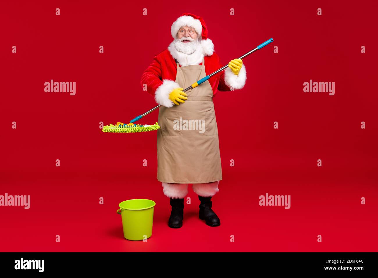 Full length photo of santa claus grey beard hold mop wear x-mas costume ...