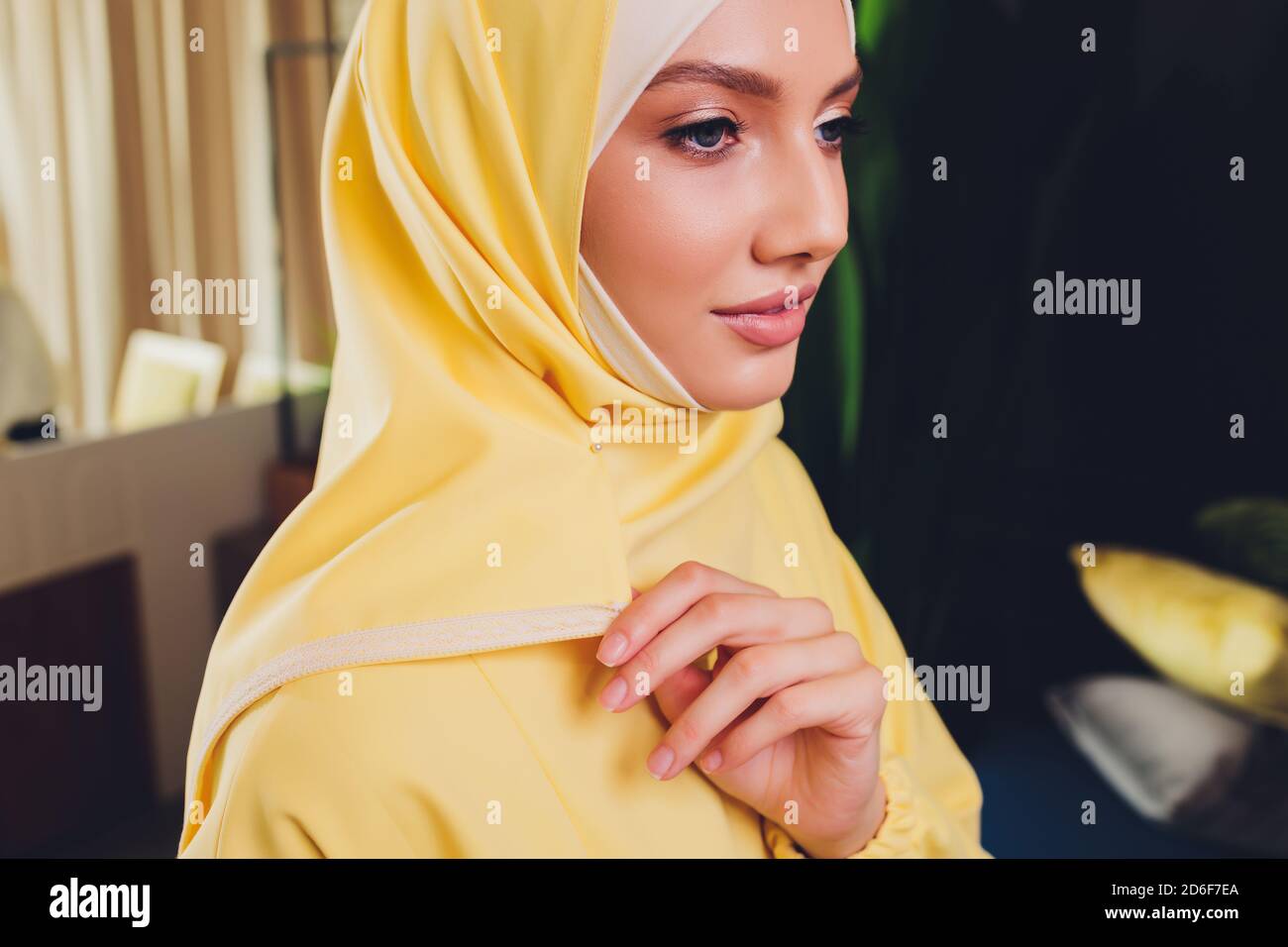 Portrait of positive pretty young Arabian woman in pink headscarf ...