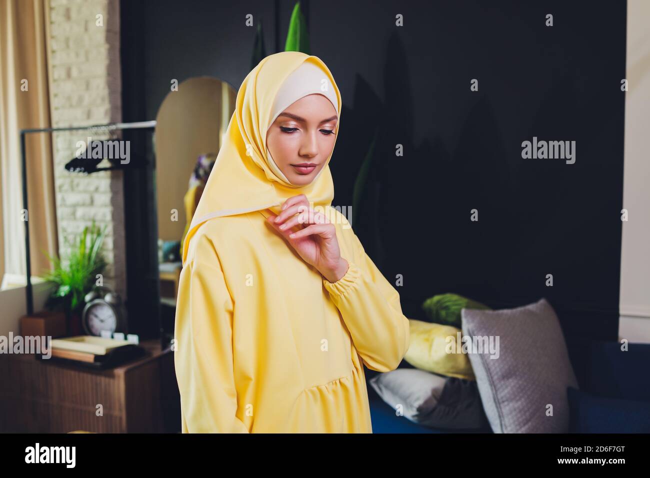 Portrait of positive pretty young Arabian woman in pink headscarf ...