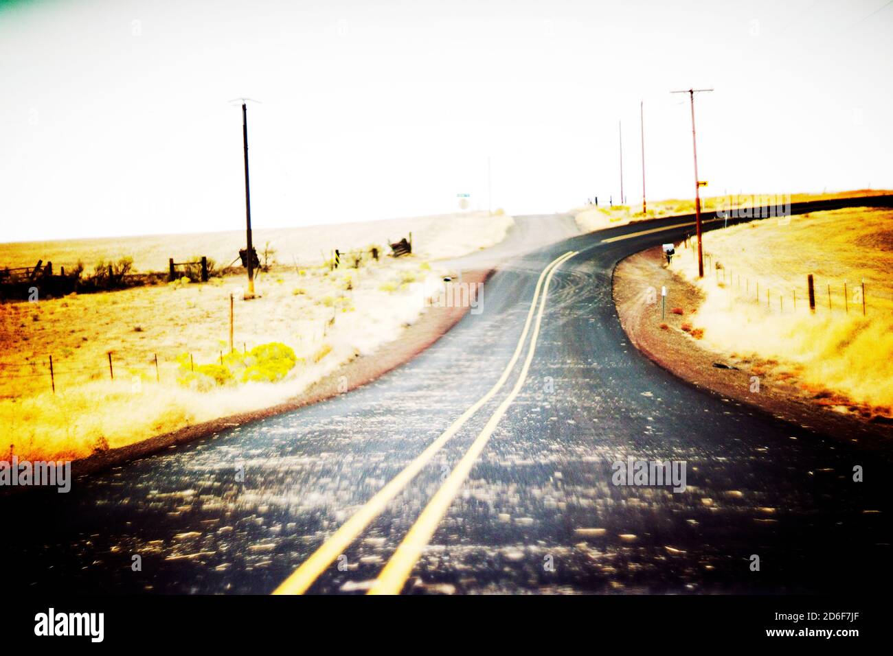 Hay scattered on Rural Two-Lane Highway Stock Photo - Alamy