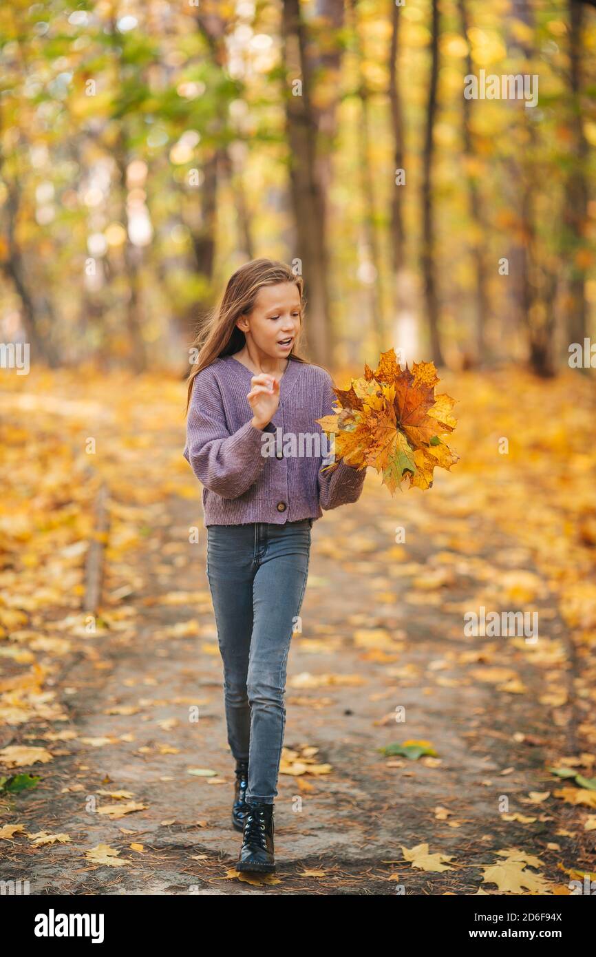 Adorable little girl at beautiful autumn day outdoors Stock Photo - Alamy