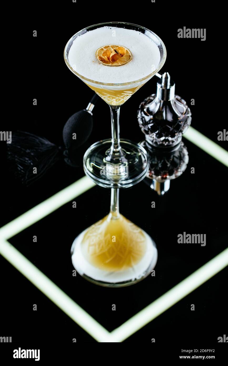 alcoholic cocktails on a mirror background Stock Photo - Alamy