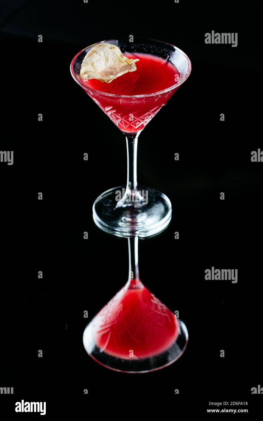 alcoholic cocktails on a mirror background Stock Photo - Alamy