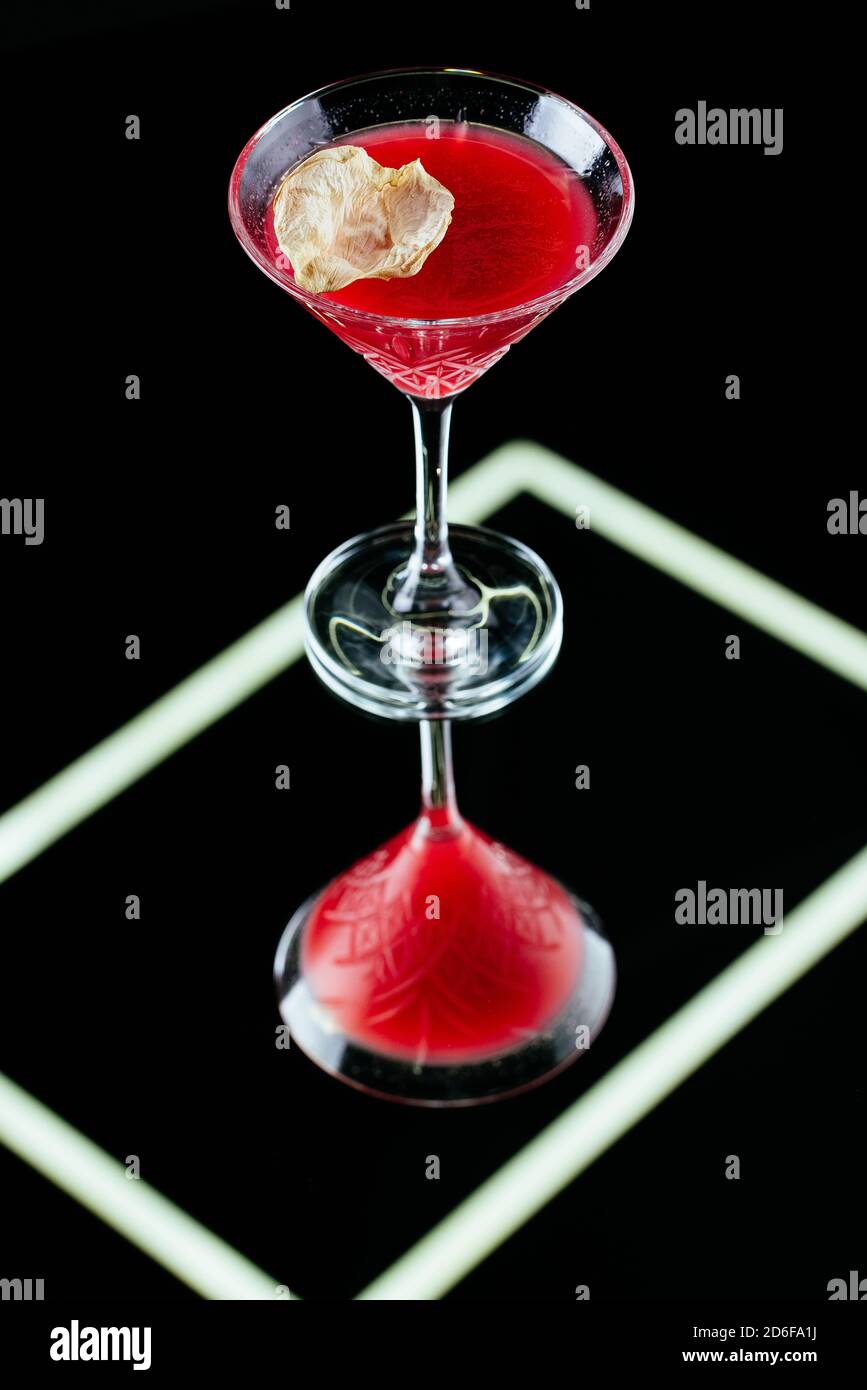 alcoholic cocktails on a mirror background Stock Photo - Alamy