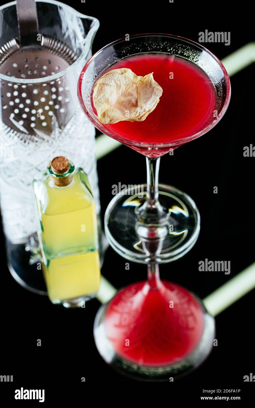 alcoholic cocktails on a mirror background Stock Photo - Alamy