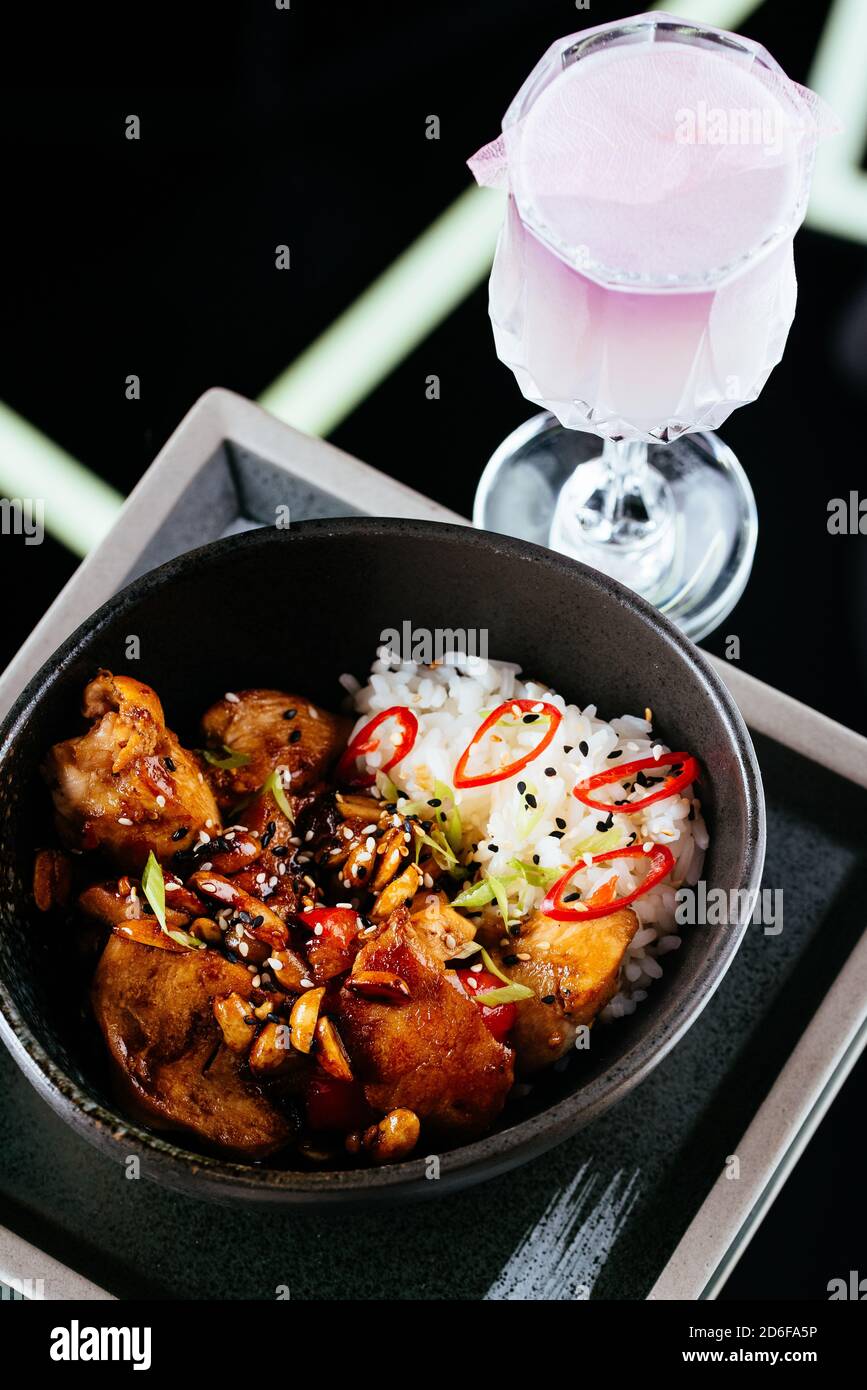Asian style chicken wings with rice on a black background Stock Photo ...