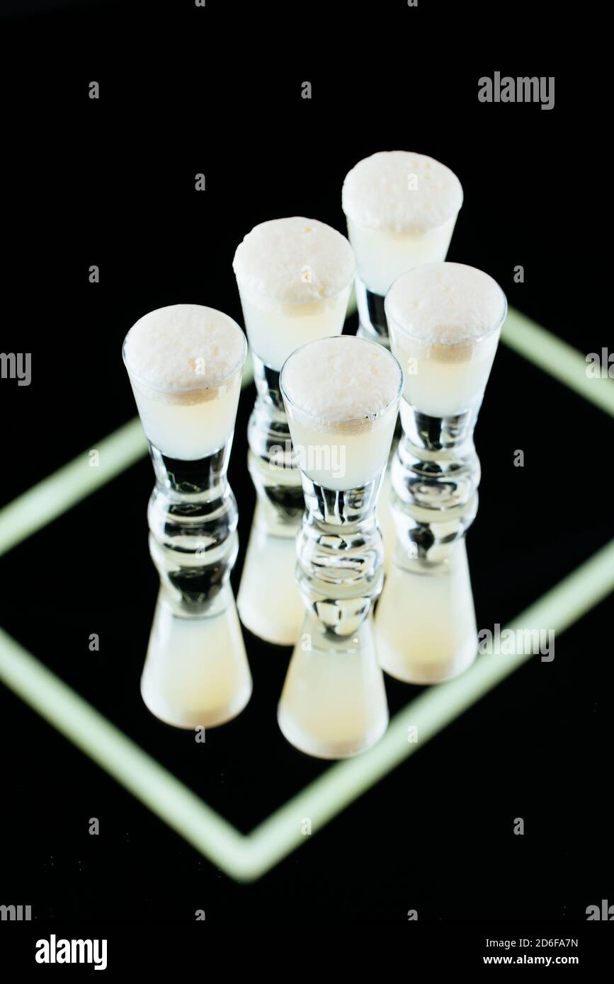 alcoholic cocktails on a mirror background Stock Photo - Alamy