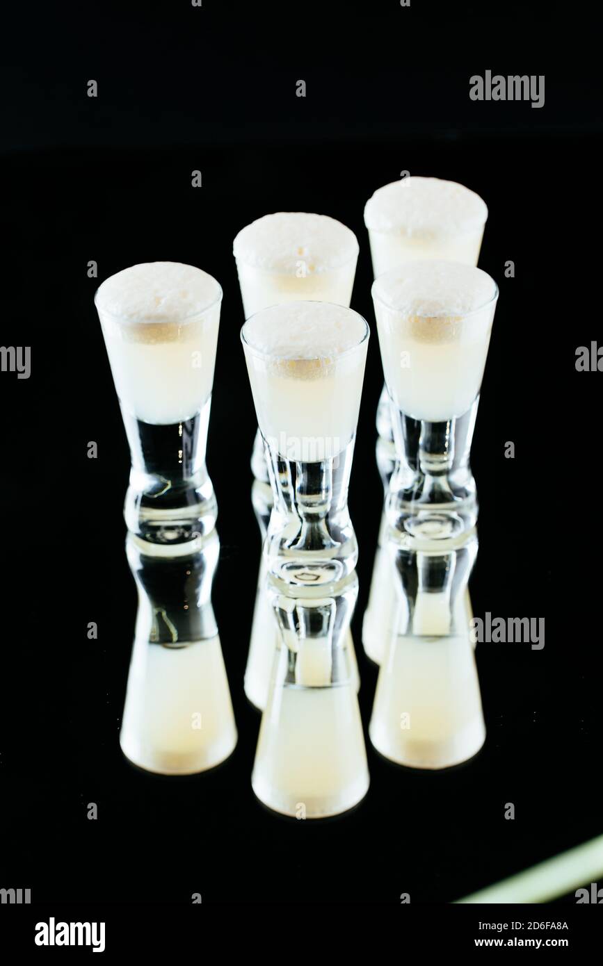 alcoholic cocktails on a mirror background Stock Photo - Alamy