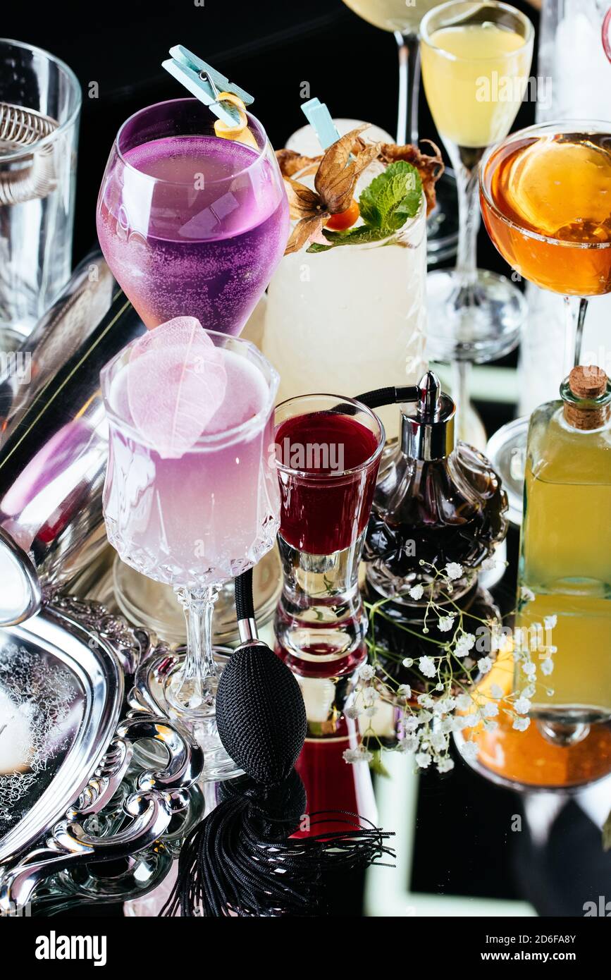 alcoholic cocktails on a mirror background Stock Photo - Alamy