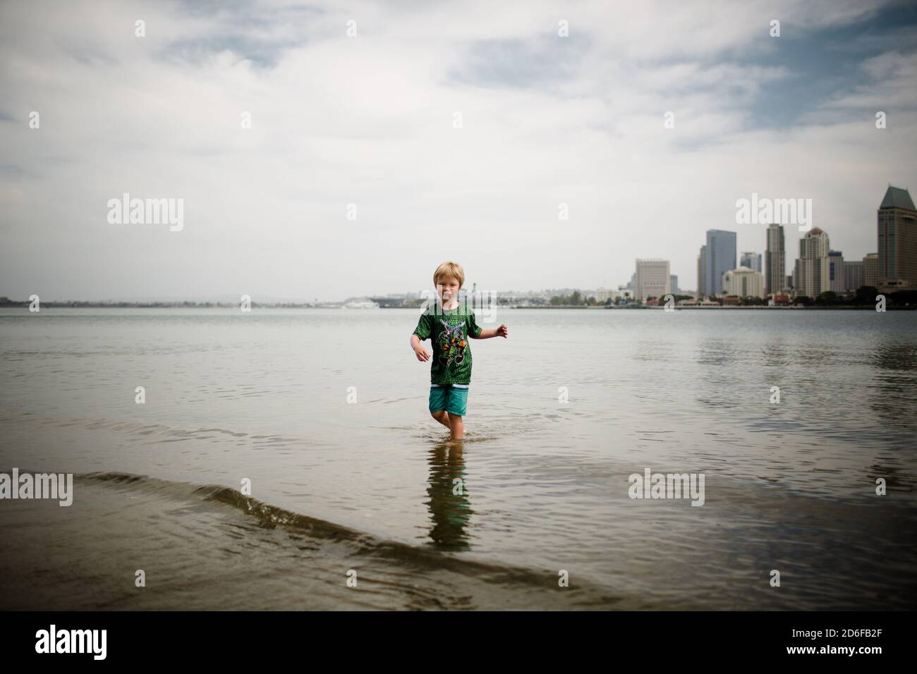 Six Year Old Boy Wading in Coronado Bay San Diego Skyline Stock Photo ...