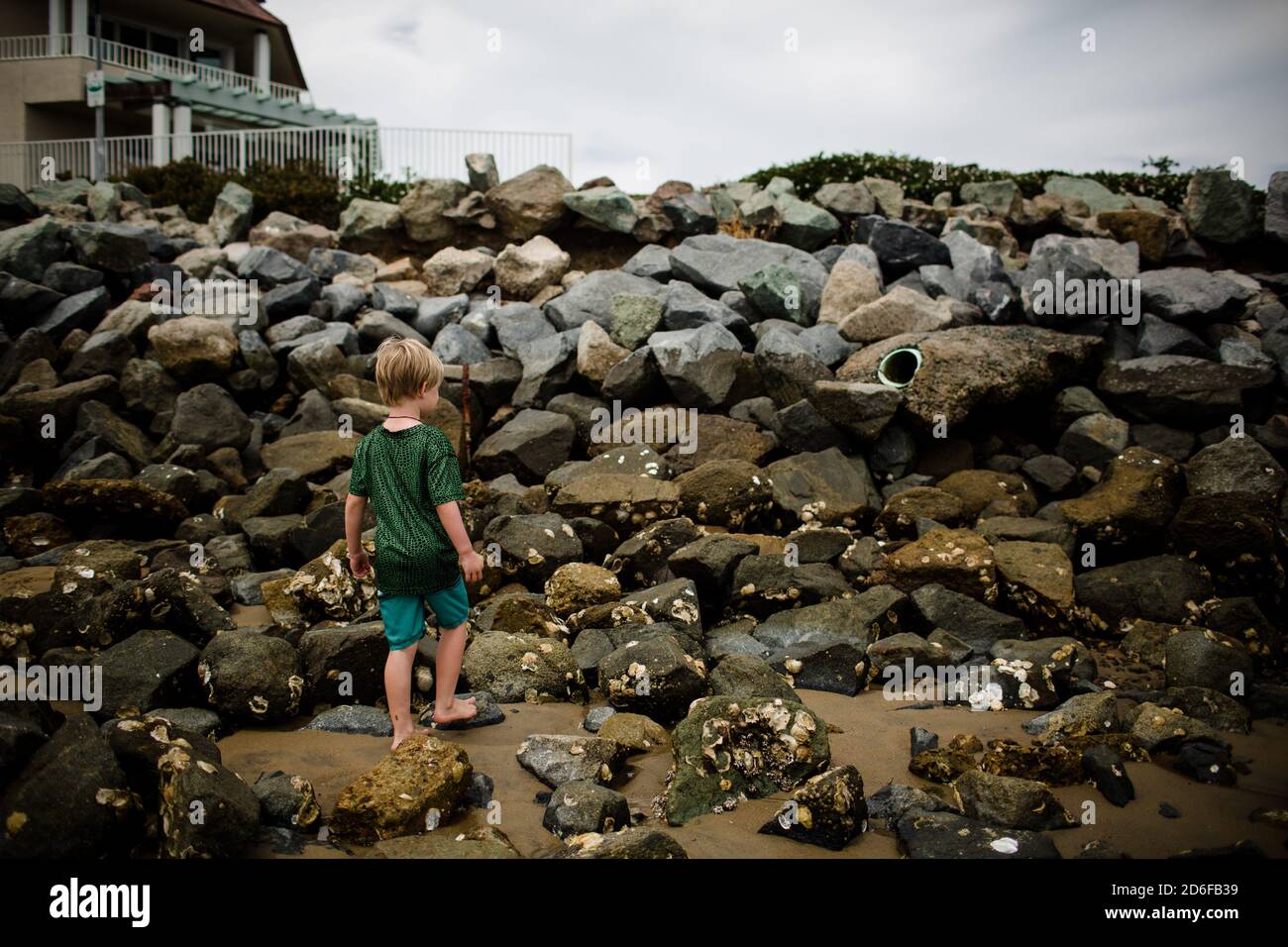 Six Year Old Boy Exploring Rocks in Coronado Bay Stock Photo - Alamy