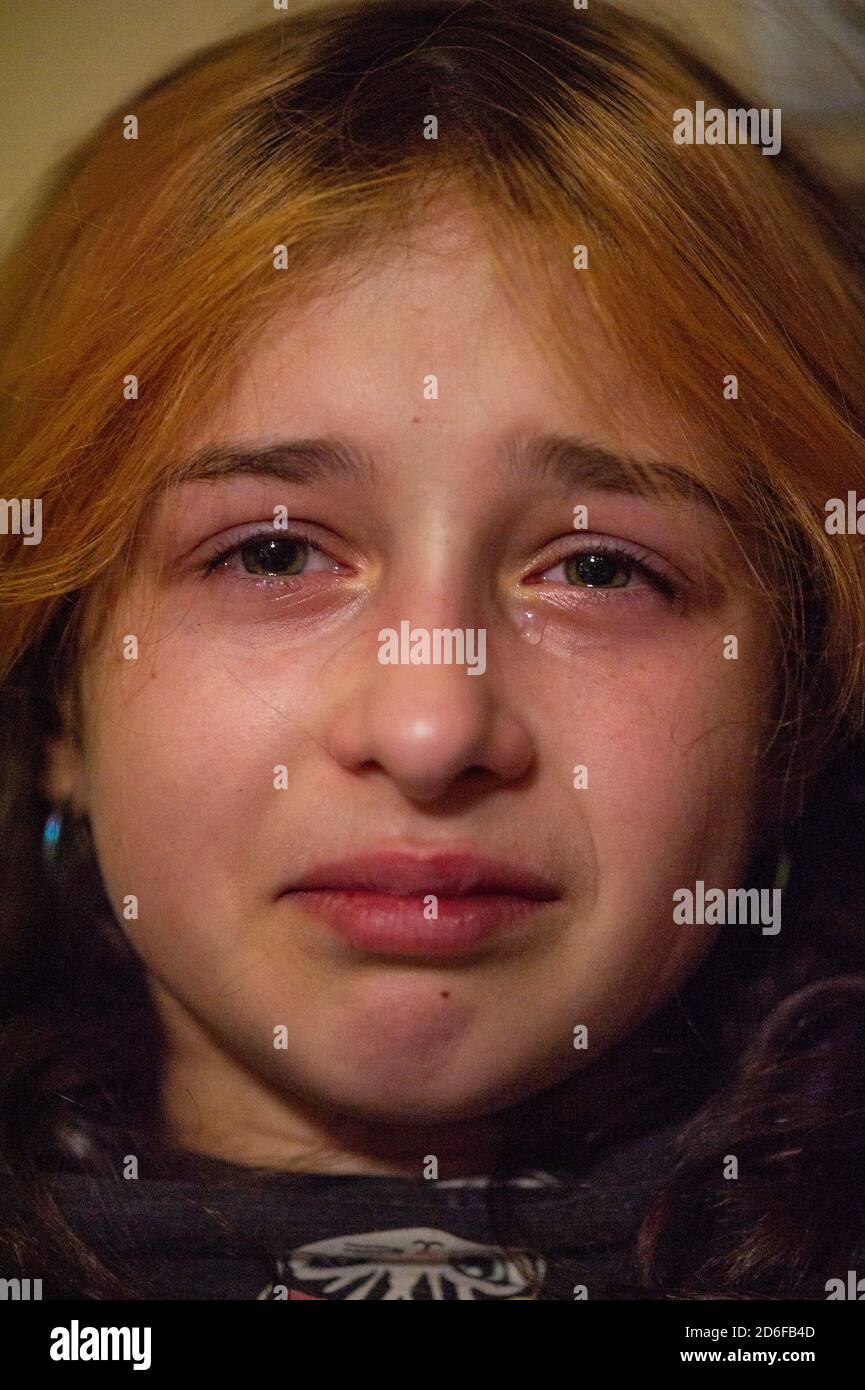 Portrait of little girl crying with tears rolling down her cheeks. Girl ...