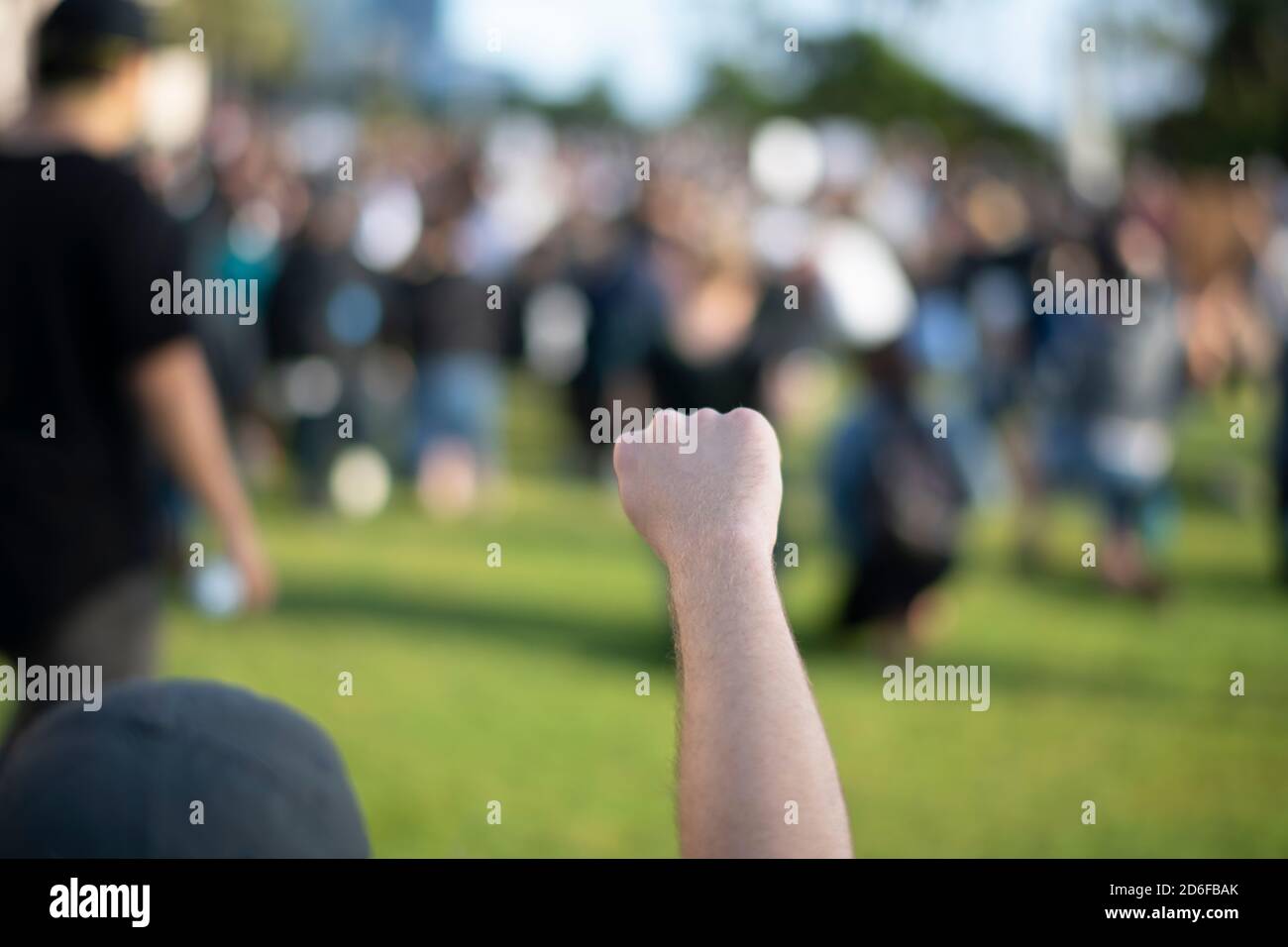 white fist being raised at a peace vigil Stock Photo - Alamy