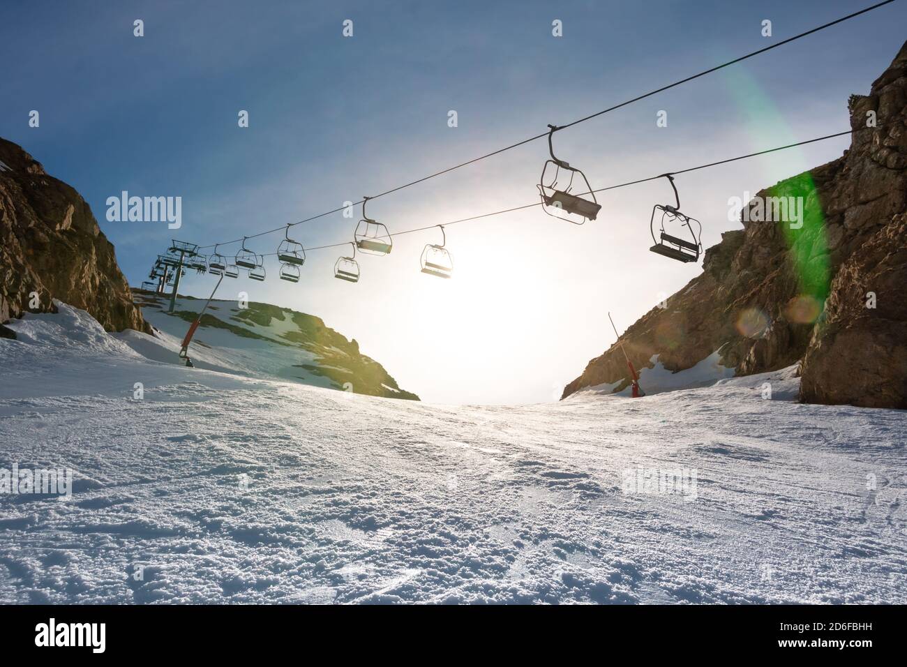 Landscape of a ski lift in a ski resort in the Pyrenees with the sun ...