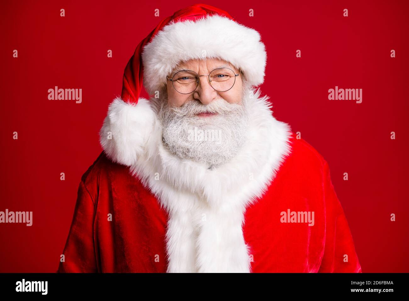 Close up photo of positive santa claus look in camera wear red costume ...