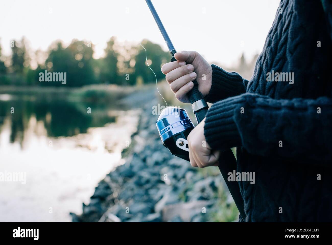Hands holding fishing rod river hi-res stock photography and images - Alamy
