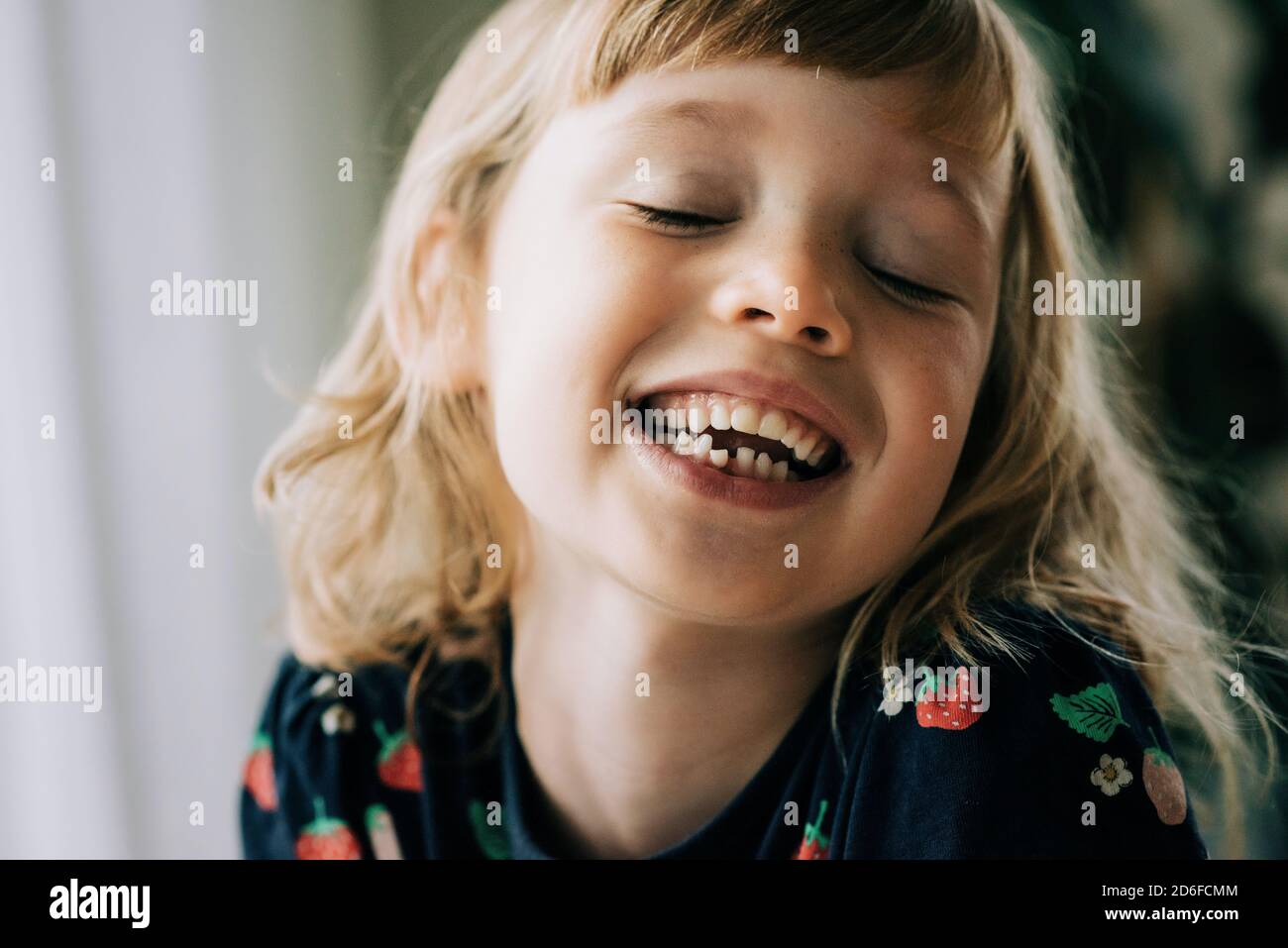 young girl with a wobbly tooth smiling showing her teeth Stock Photo ...