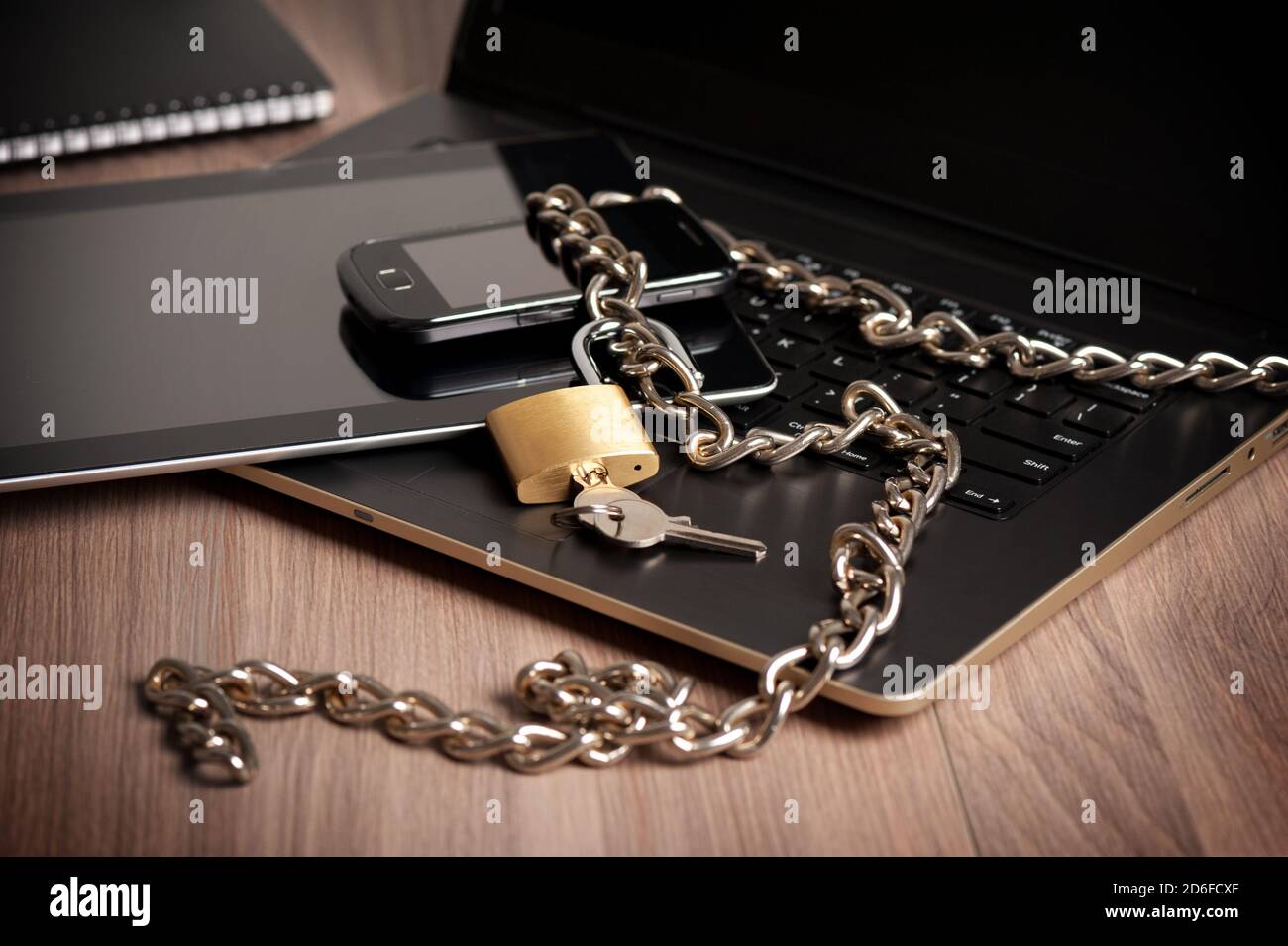 laptop with chain and unlocked padlock, computer and data security ...