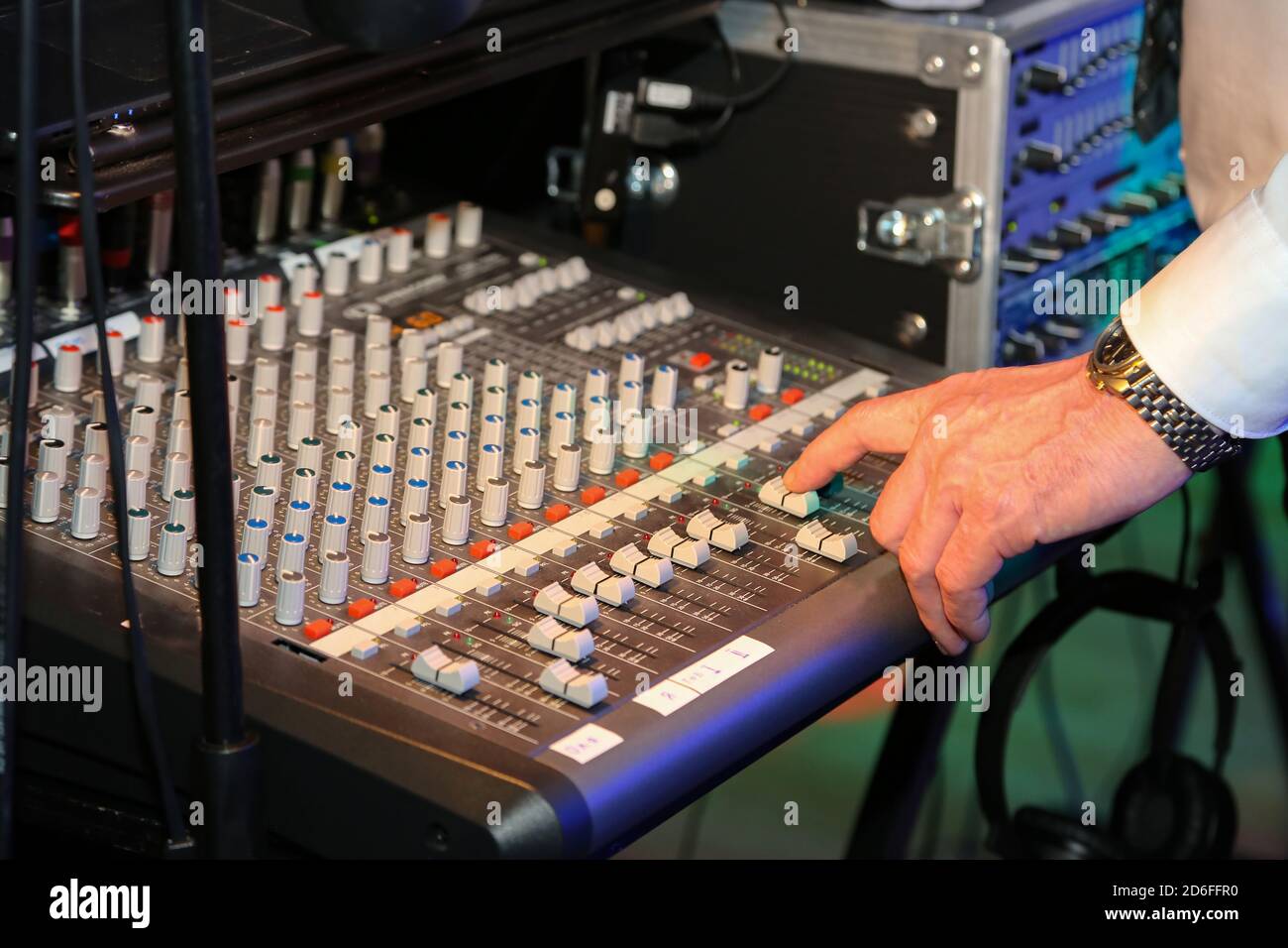 Closeup shot of a man using a sound mixer Stock Photo - Alamy