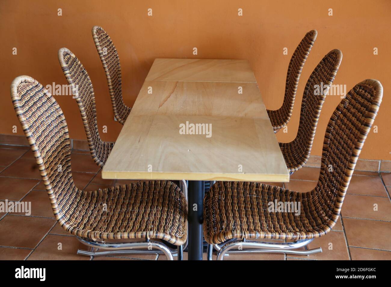 Wooden table with six chairs around for team meetings and discussions ...