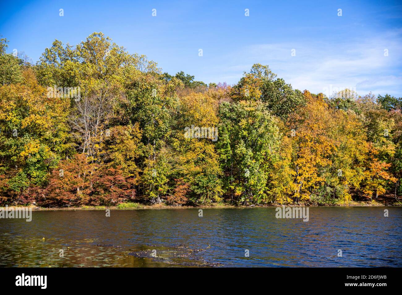The beautiful colors of the autumn along a lake in upstate New York ...