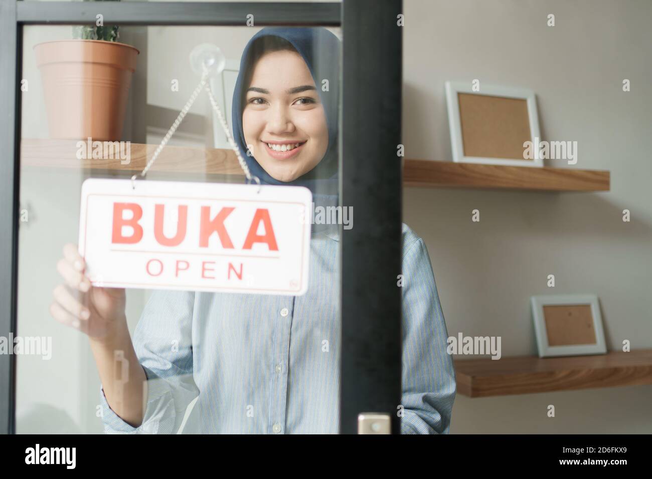you are welcome! cheerful mature woman in welcome sign and smiling ...