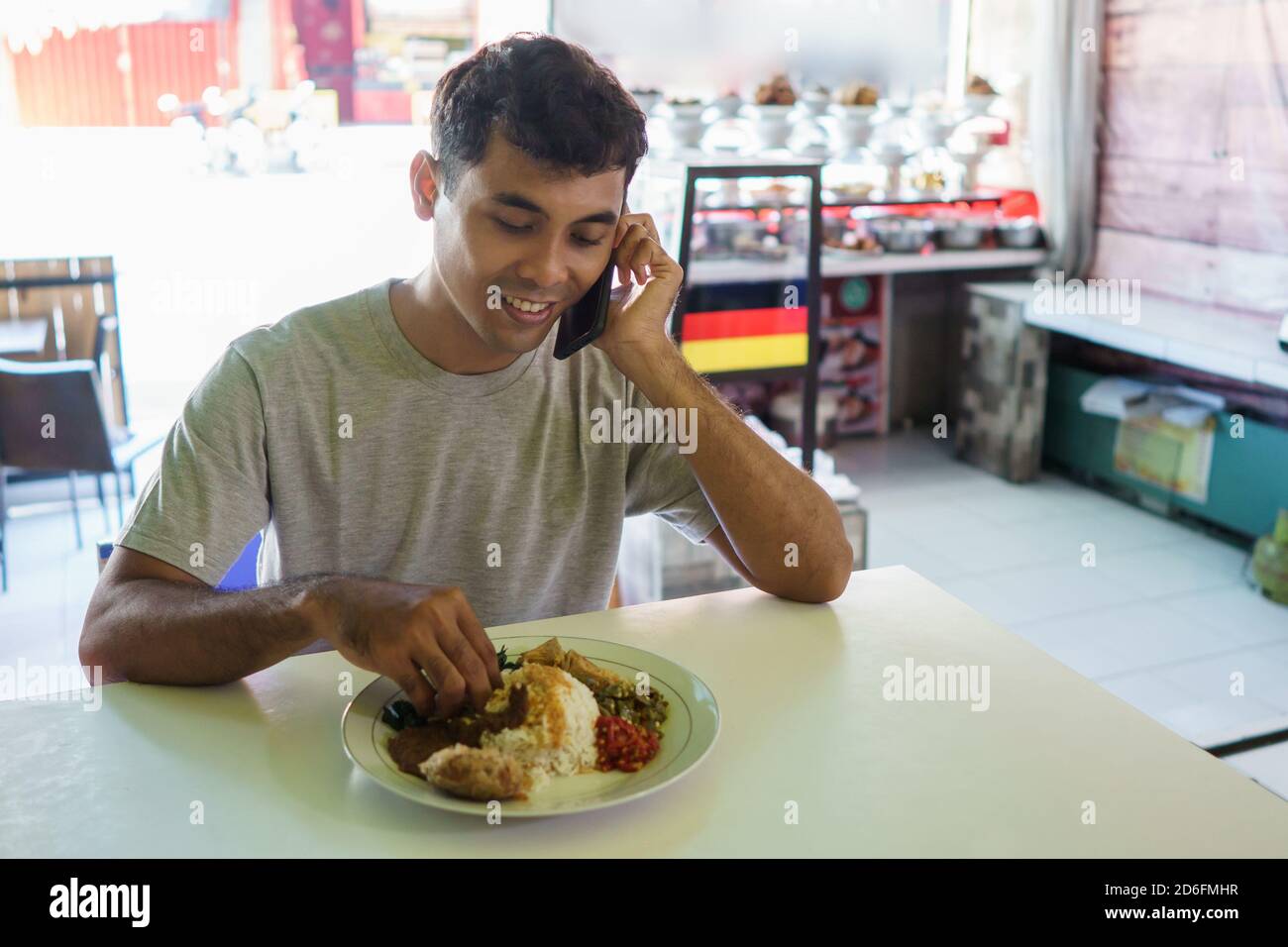 Man eating curry hi-res stock photography and images - Alamy