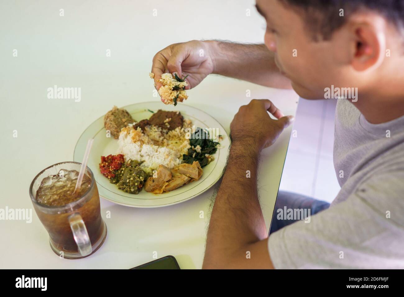 Man eating curry hi-res stock photography and images - Alamy