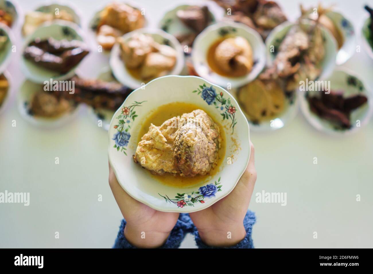 a portrait of beef brain food on a plate in a traditional food dish ...