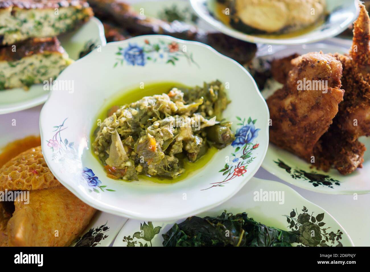 portrait green chilli sauce on a plate on in a traditional food dish ...