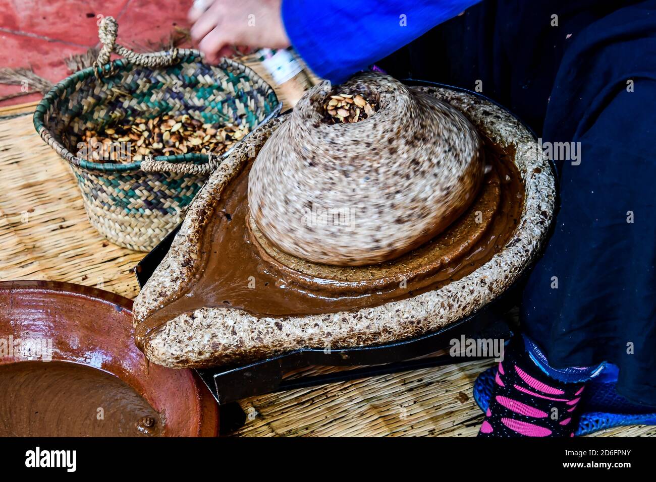 Argan oil extraction by traditional stone handmill mill Stock Photo - Alamy