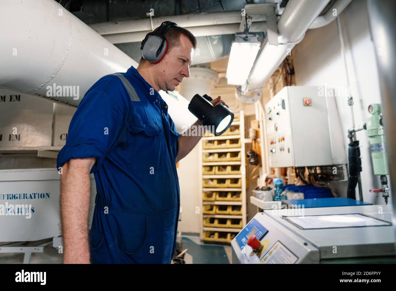 Marine engineer officer controlling vessel enginesand propulsion in ...