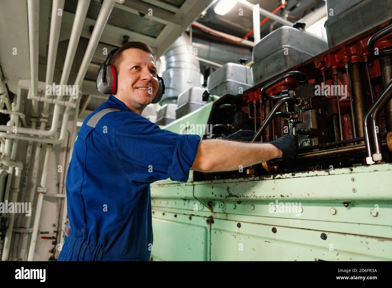 Marine engineer officer controlling vessel enginesand propulsion in ...