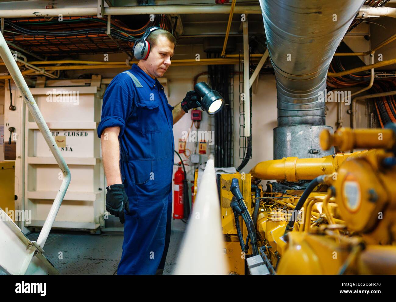 Marine engineer officer controlling vessel enginesand propulsion in ...