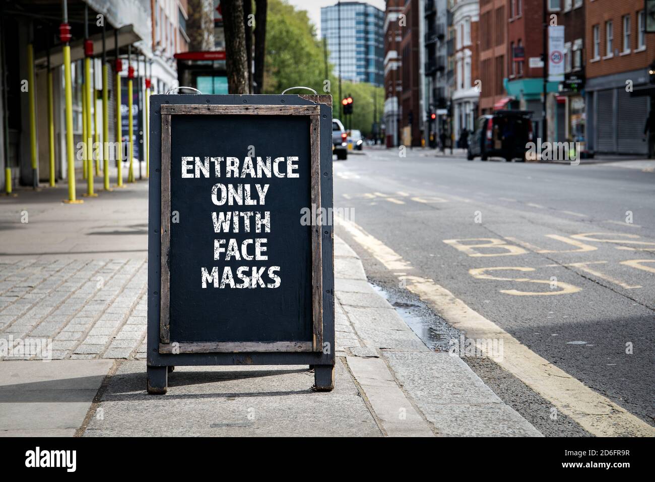 ENTRANCE ONLY WITH FACE MASKS. Foldable advertising poster on the ...