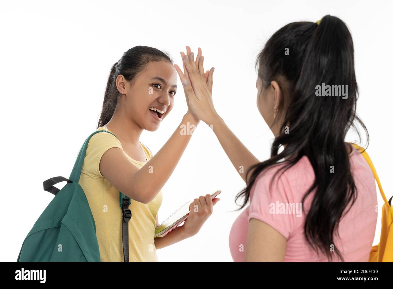 two couple student meet friend carrying bag and books in casual clothes ...