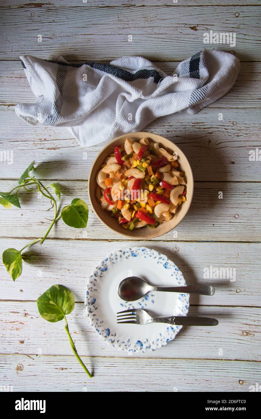 Vertical top view of Macaroni pasta in a bowl Stock Photo - Alamy