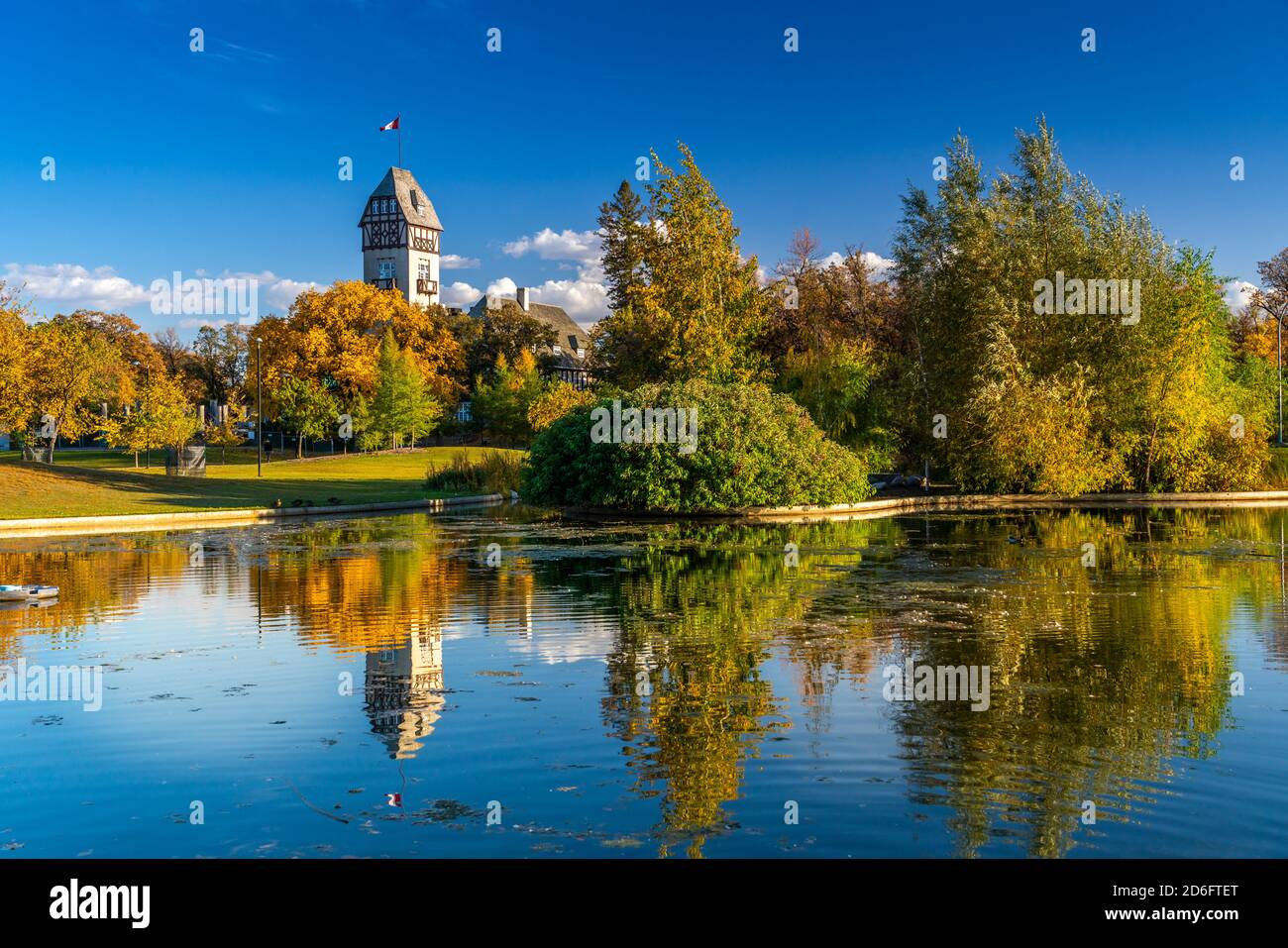 The Assiniboine Park Pavilion with fall foliage color reflected in a ...