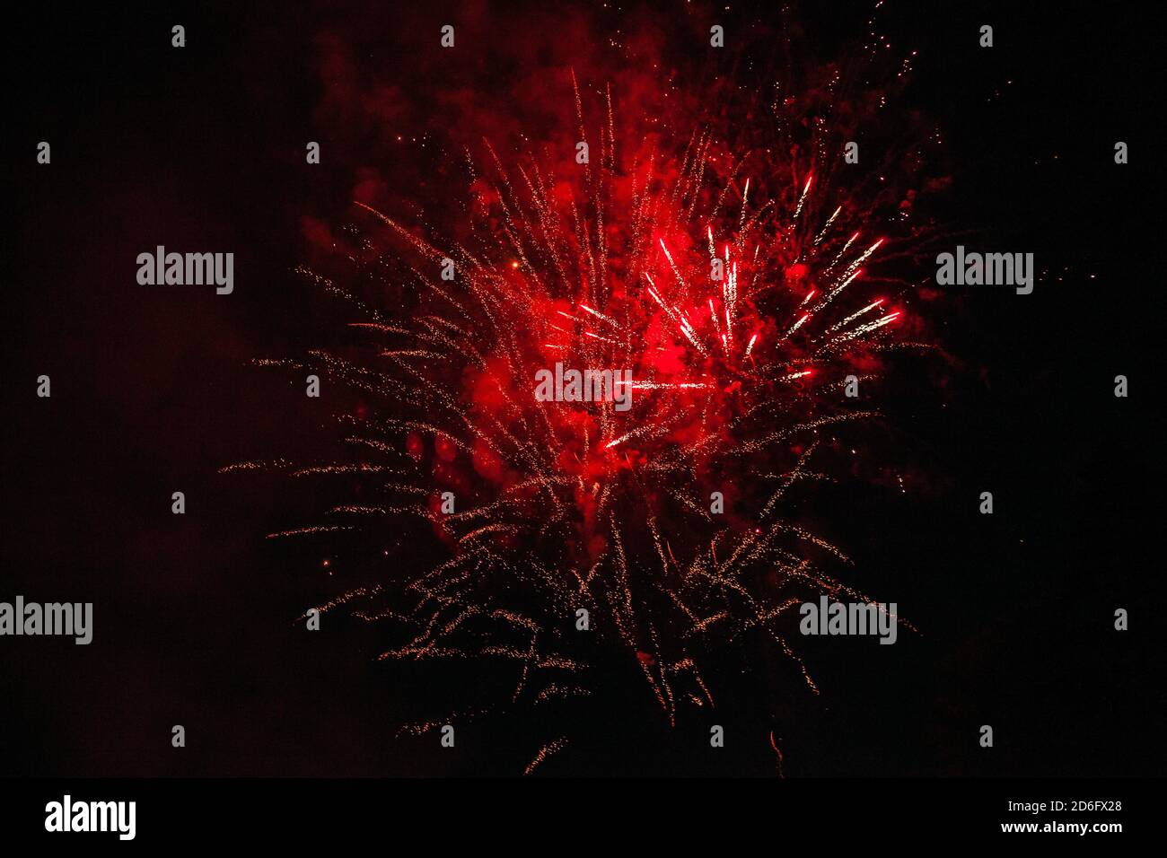 Bright red fireworks in the night sky Stock Photo - Alamy